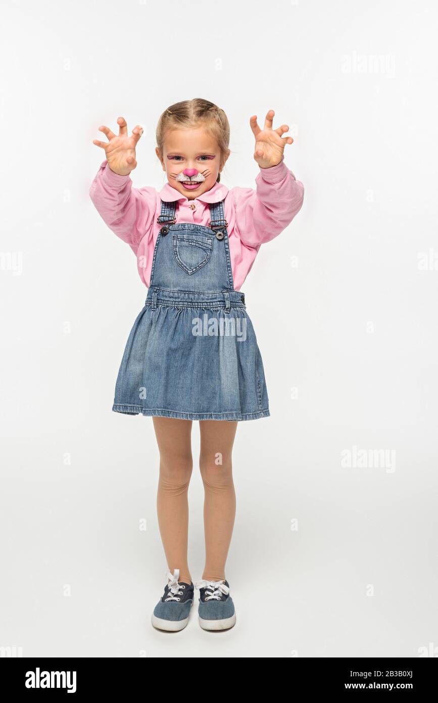 full length view of cute kid with cat muzzle painting on face showing ...