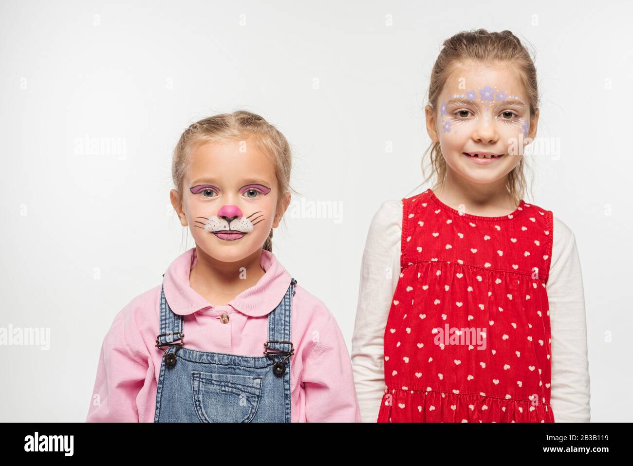adorable children with flowers and cat muzzle paintings on faces ...