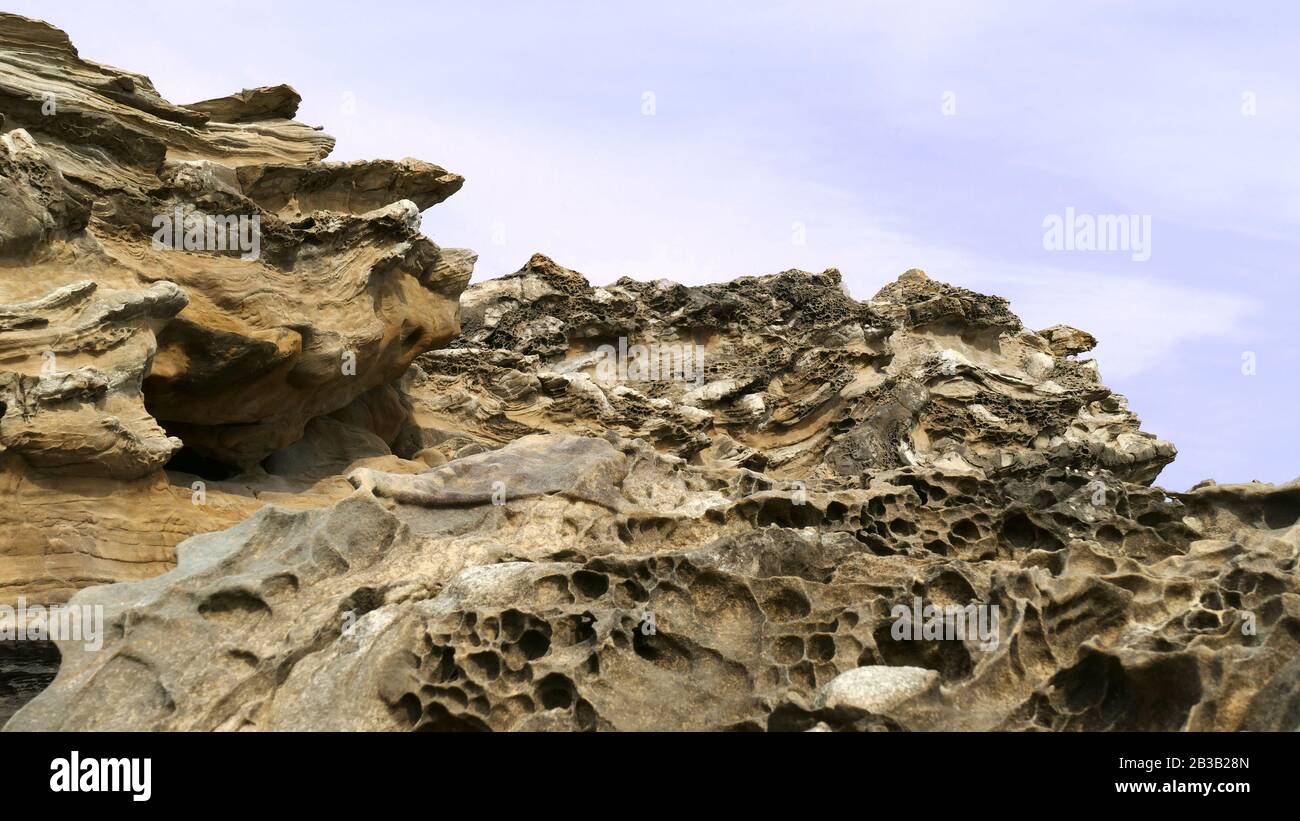 Rocks and limestone eroded on the coast of the sea Stock Photo - Alamy