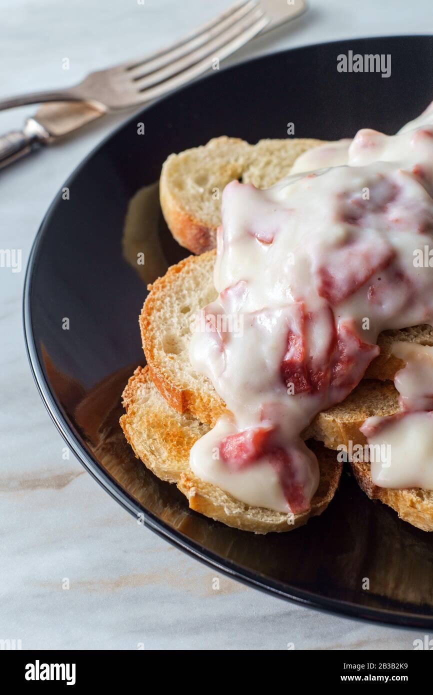Creamed and chipped beef on sliced toast on marble kitchen table also ...
