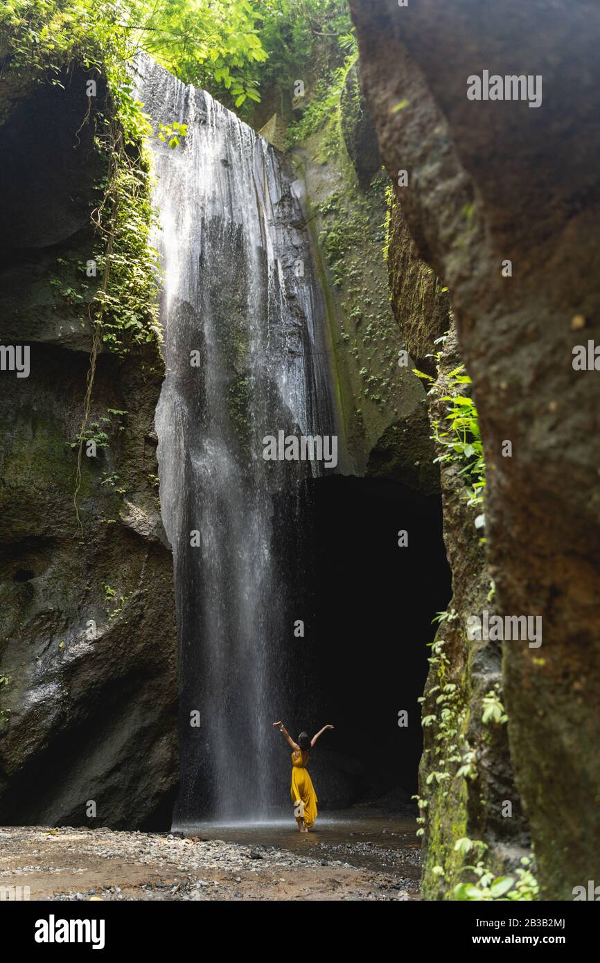 Slim female person standing in the gorge Stock Photo - Alamy
