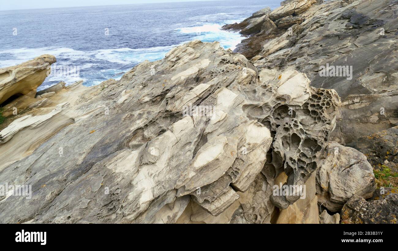 Rocks and limestone eroded on the coast of the sea Stock Photo - Alamy