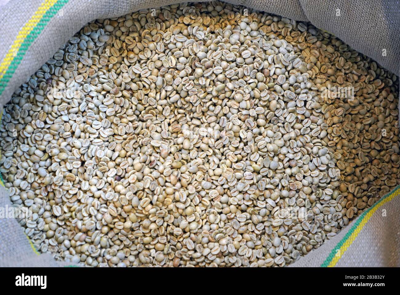 Light color coffee beans background Stock Photo - Alamy