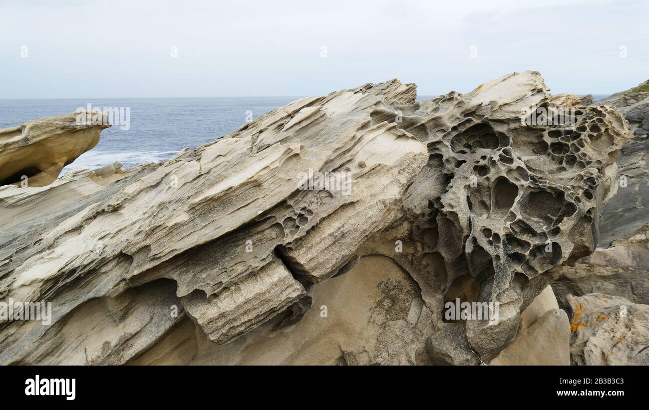 Rocks and limestone eroded on the coast of the sea Stock Photo - Alamy