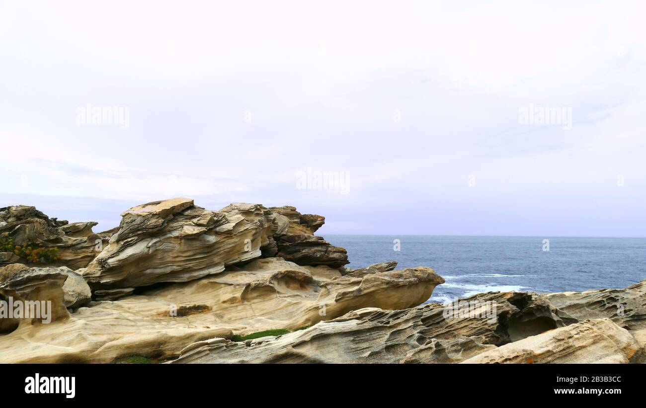 Rocks and limestone eroded on the coast of the sea Stock Photo - Alamy