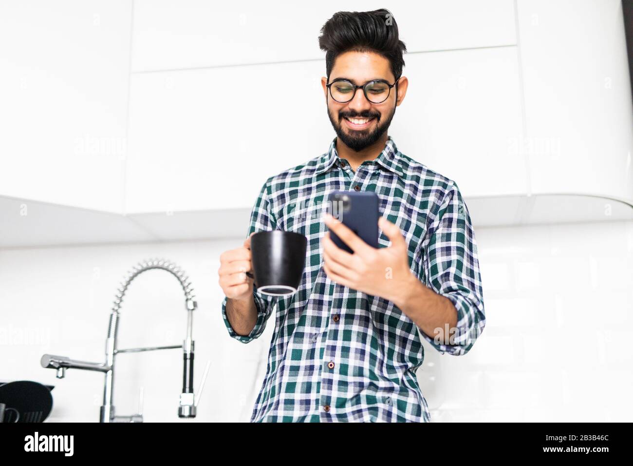 Attractive indian man read hi-res stock photography and images - Alamy