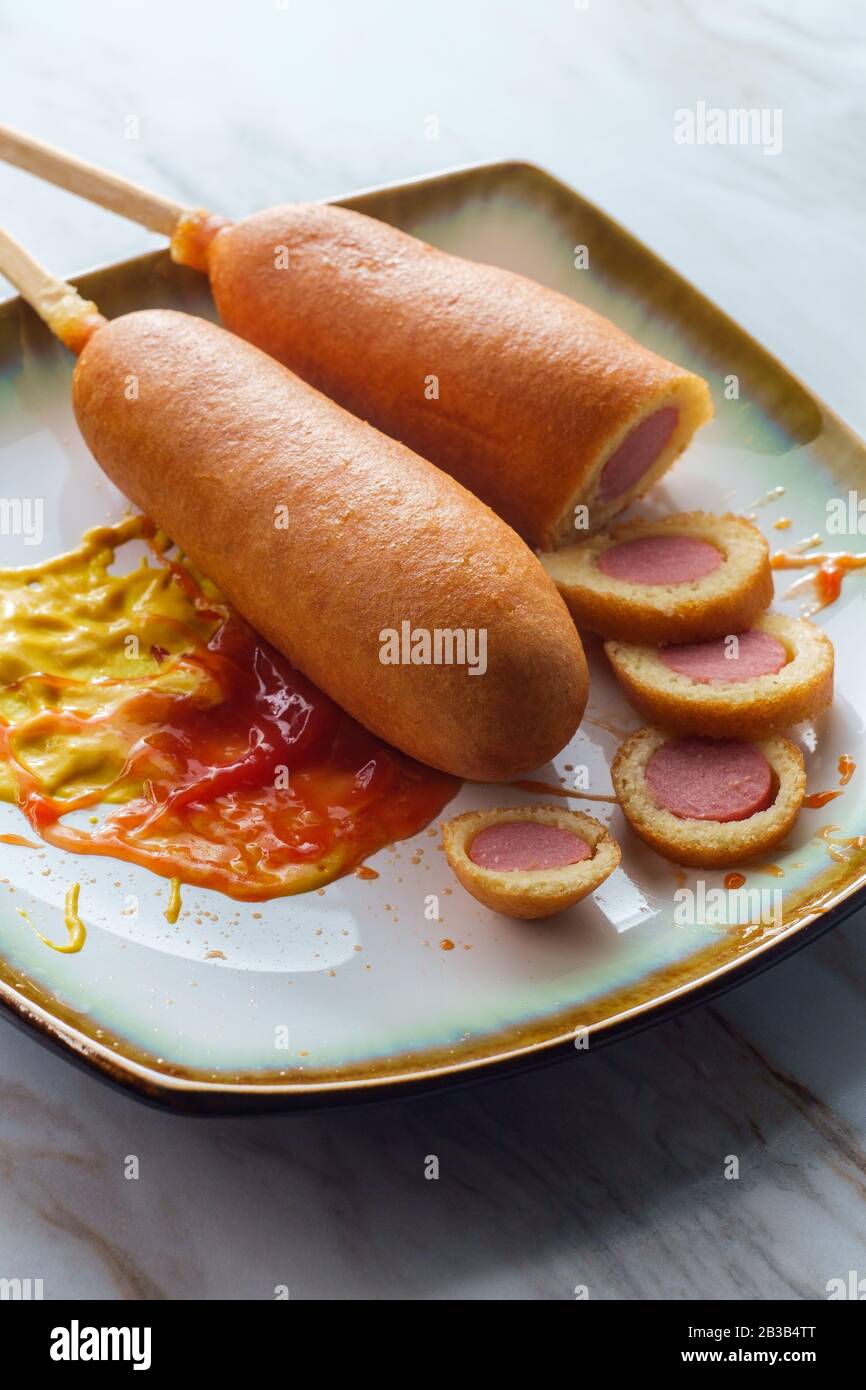 American fast-food cuisine messy corn dog Stock Photo - Alamy