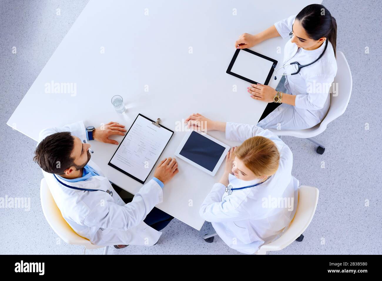 Group of doctors with gadgets in hospital , top view Stock Photo - Alamy