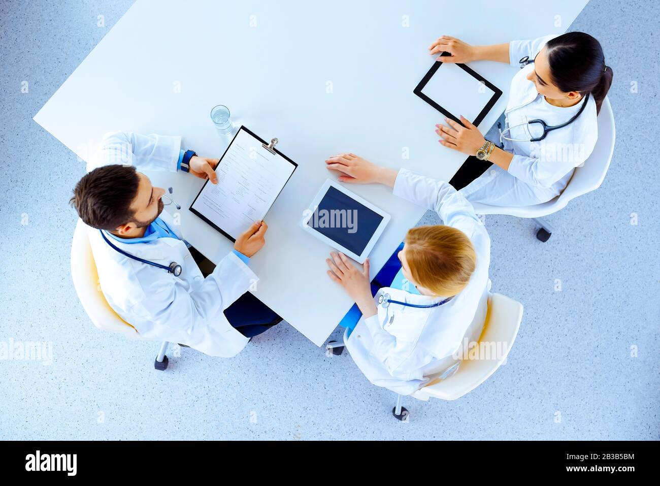 Group of doctors with gadgets in hospital , top view Stock Photo - Alamy