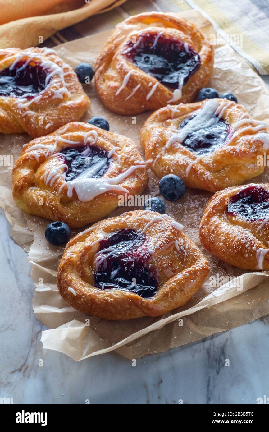 Blueberry glazed danish dessert pastries with icing and powdered sugar ...