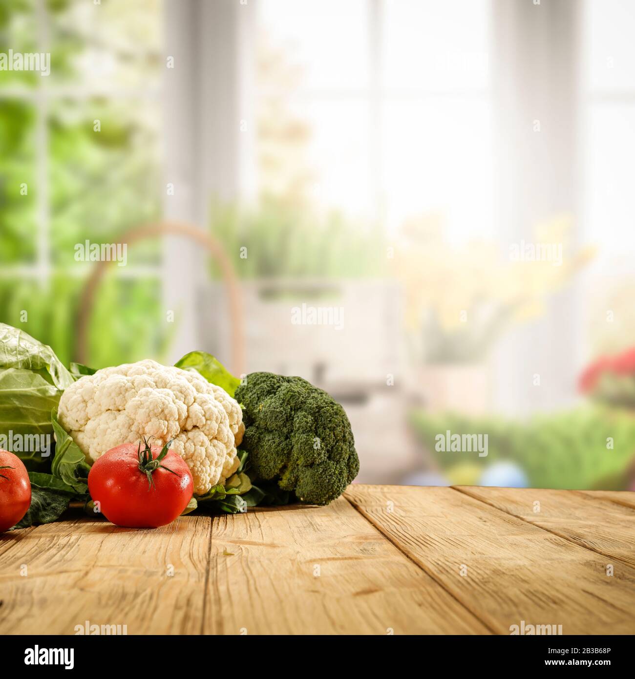 Spring time and fresh vegetables with wooden table with idyllic rural ...