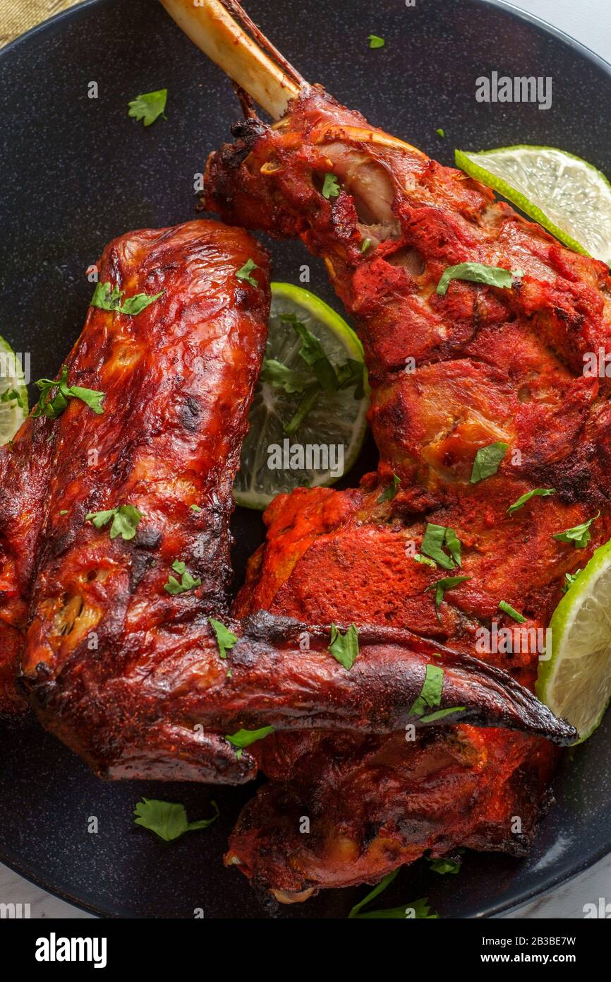 Indian cuisine spicy red Tandoori chicken with cucumber raita Stock ...