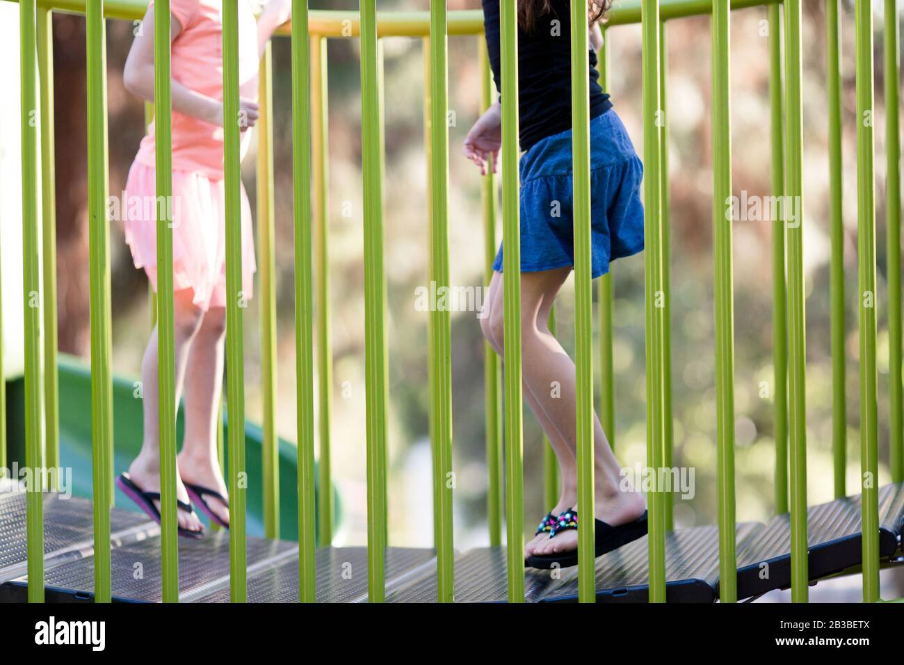 Sisters are playing and using teamwork on the playground Stock Photo ...
