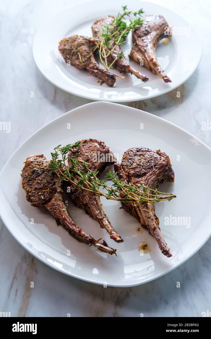 Fancy and simple marinated French lamb rib with thyme garnish Stock ...
