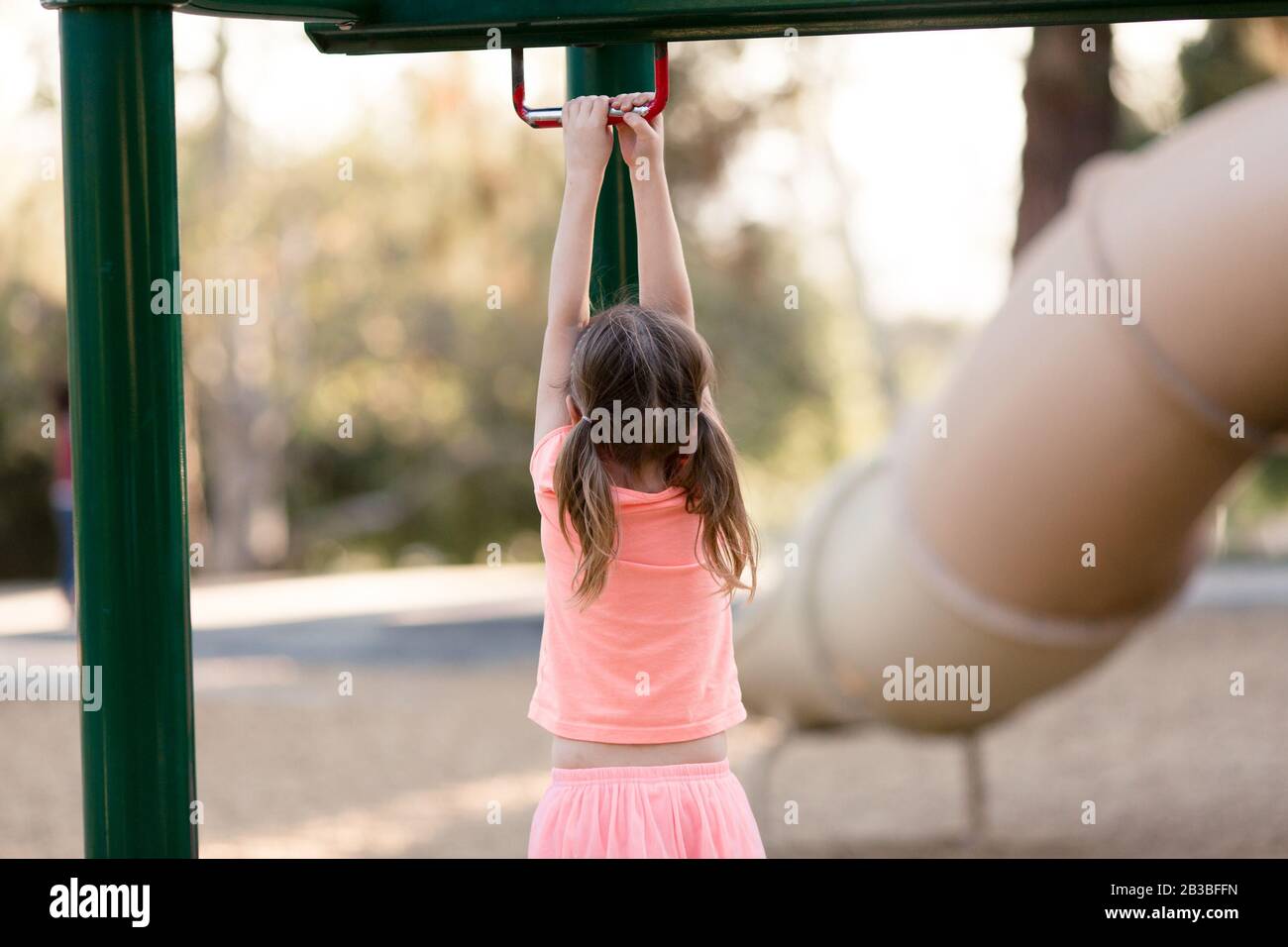 Sisters are playing and using teamwork on the playground Stock Photo ...