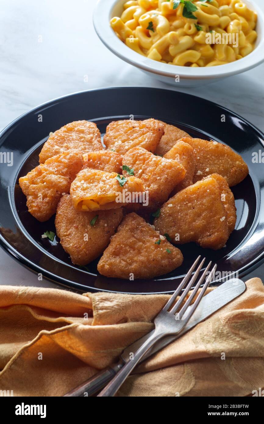 Battered and deep-fried macaroni and cheese wedges appetizer Stock ...