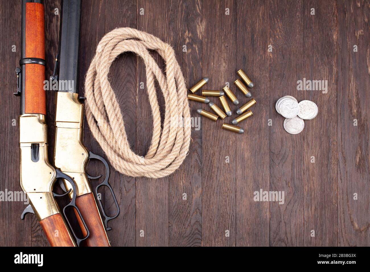 Wild west guns - lever-action repeating rifles with ammunition on ...