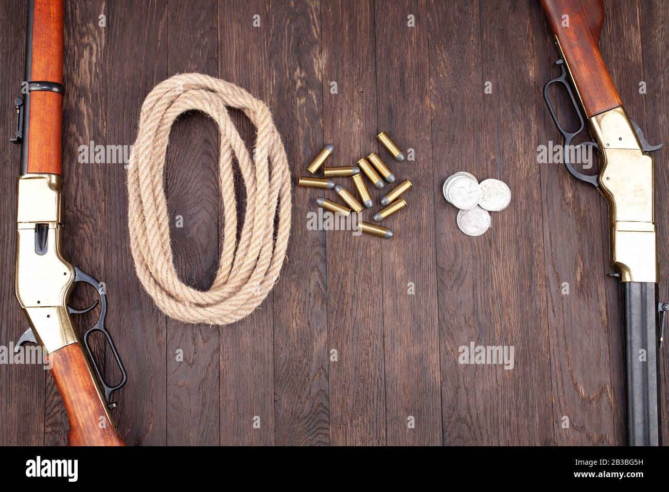 Wild west guns - lever-action repeating rifles with ammunition on ...