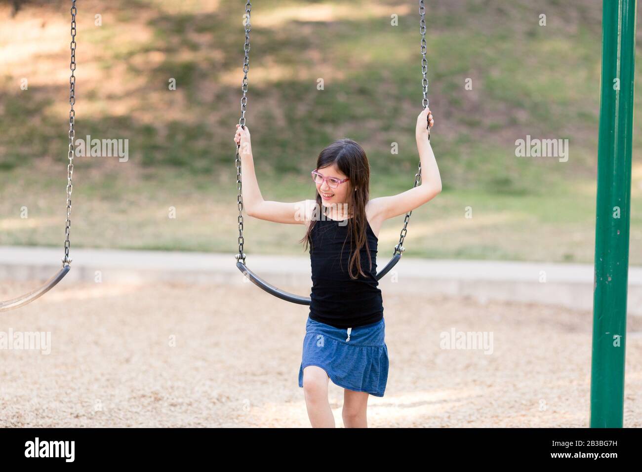 Sisters are playing and using teamwork on the playground Stock Photo ...