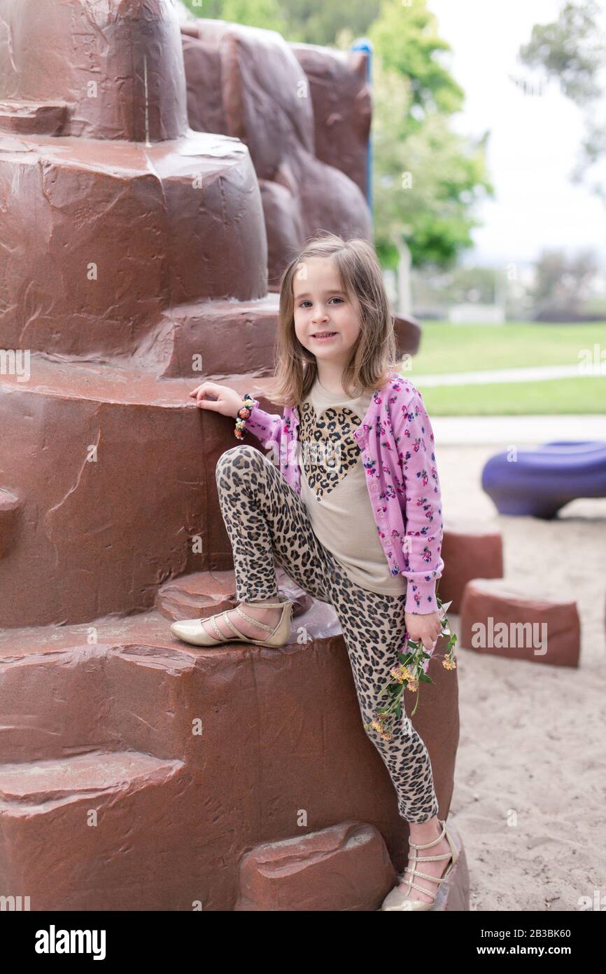 Sisters are playing and using teamwork on the playground Stock Photo ...