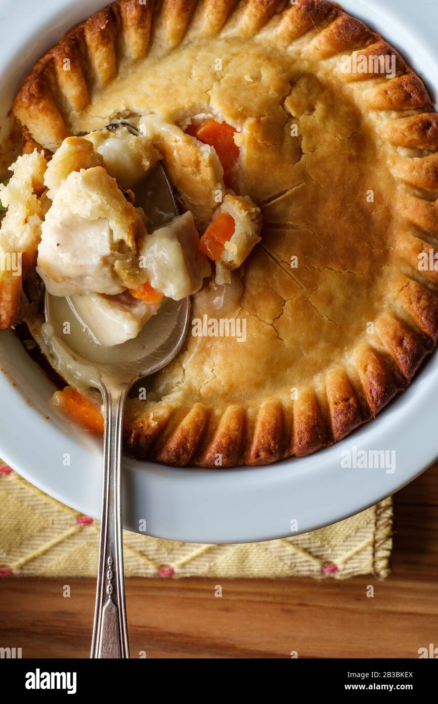 Crispy flaky baked chicken pot pie in white bowl Stock Photo - Alamy