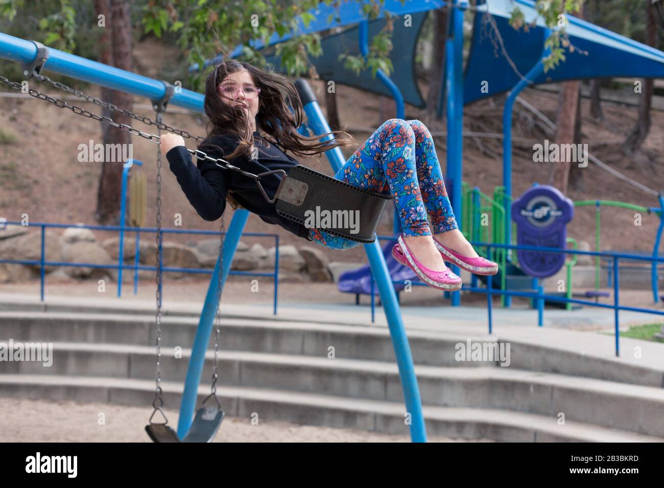 Sisters are playing and using teamwork on the playground Stock Photo ...