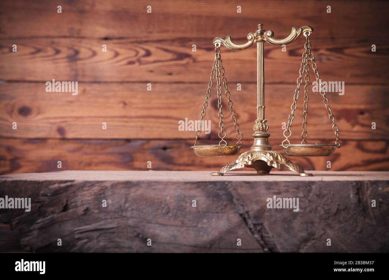 vintage golden scale on top of a plank of old oak wood with copy space ...