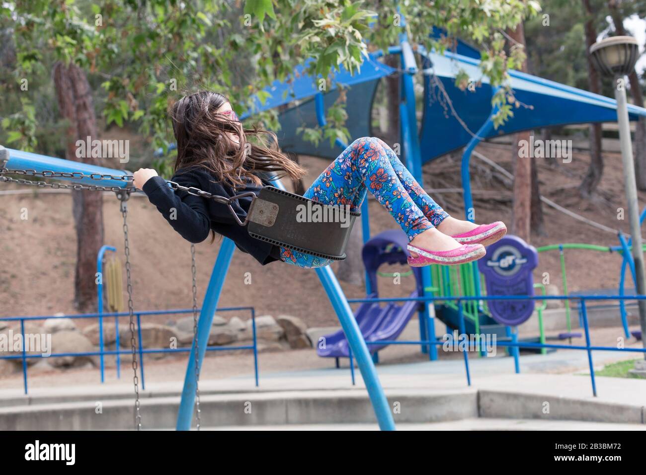 Sisters are playing and using teamwork on the playground Stock Photo ...