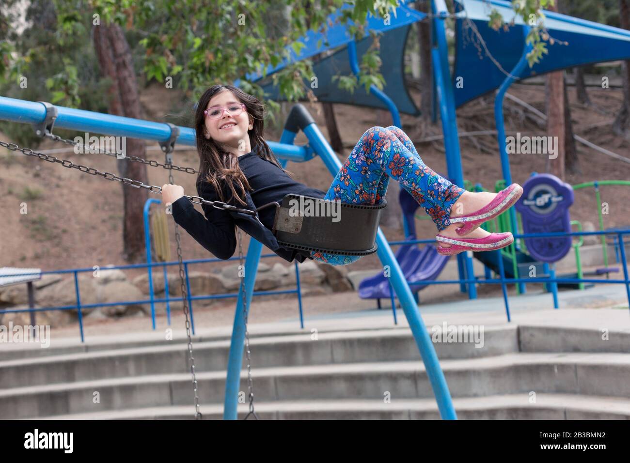Sisters are playing and using teamwork on the playground Stock Photo ...