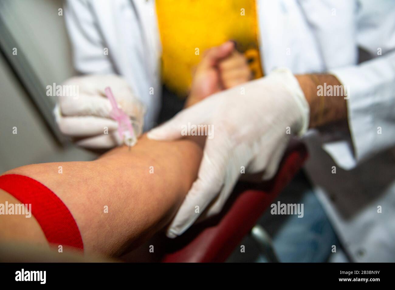 Nurse taking blood sample from patient at the doctors office Stock ...
