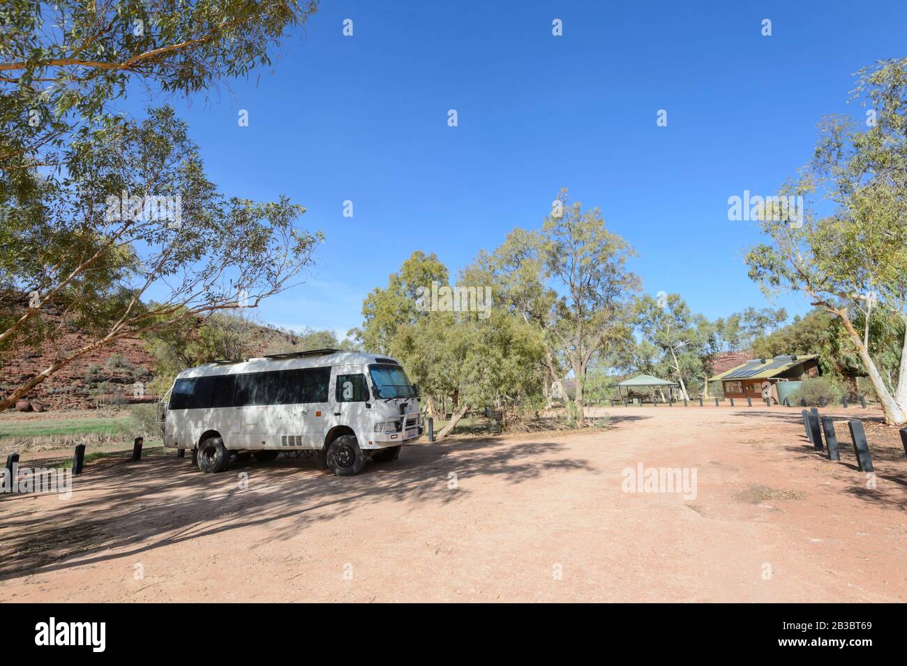 4WD Toyota Coaster motorhome parked at the remote Palm Valley bush ...