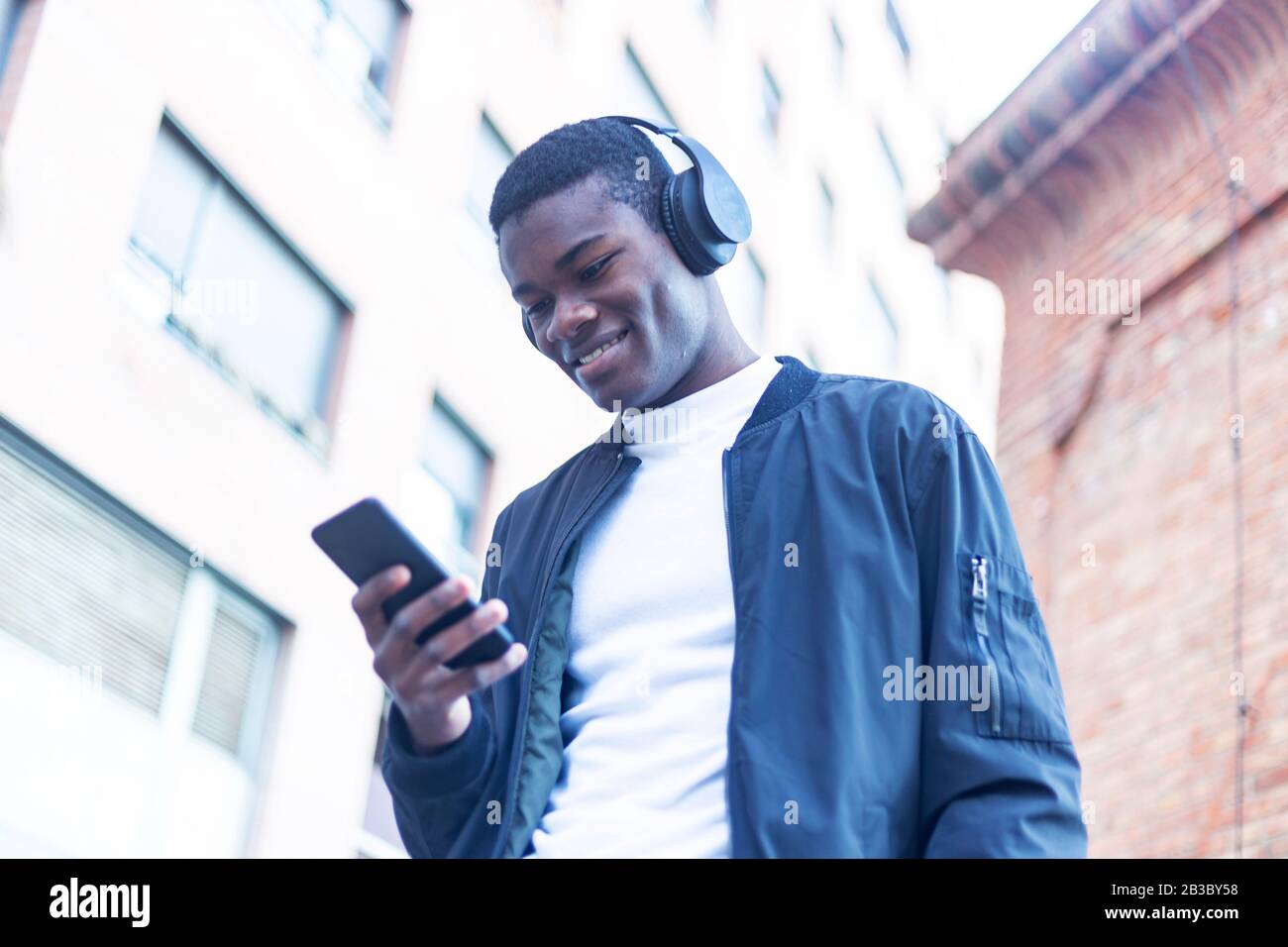 African Young Man Listening Music Stock Photo - Alamy