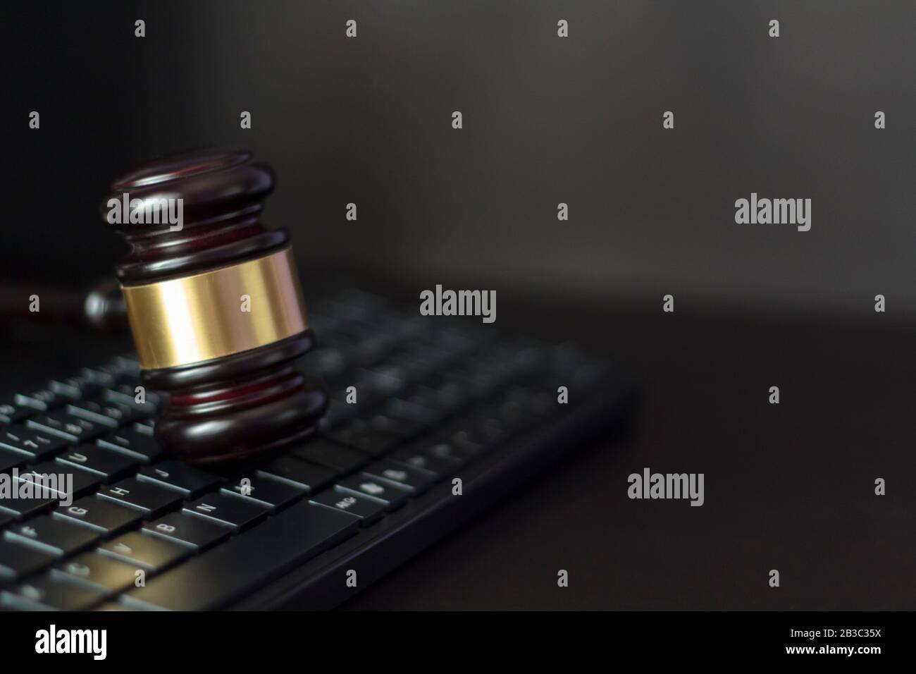 Judge's gavel on computer keyboard with copy space Stock Photo - Alamy