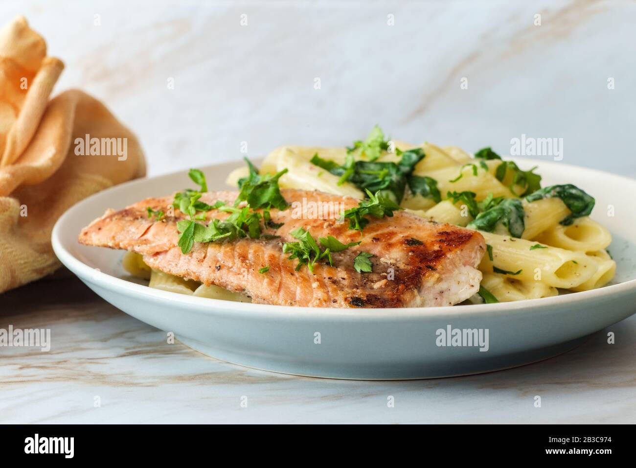 Italian fried salmon and penne rigate with creamy spinach alfredo pasta ...
