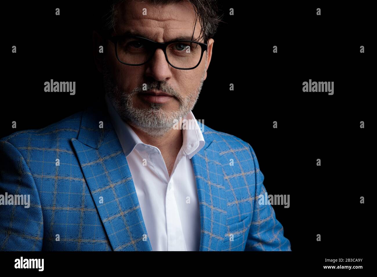 close up of a good looking formal business man wearing blue suit and ...