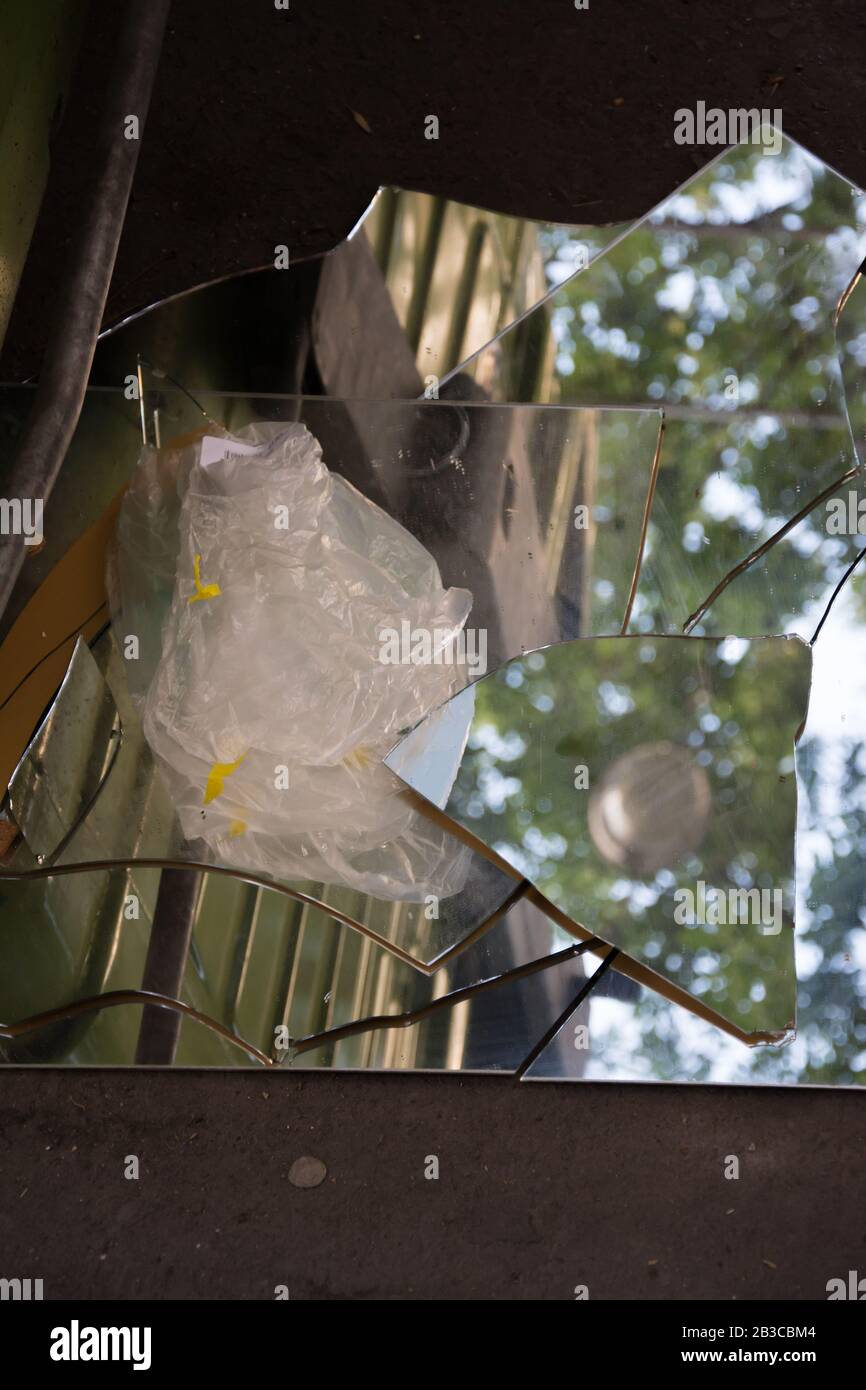 Reflection of a broken mirror on the street Stock Photo - Alamy