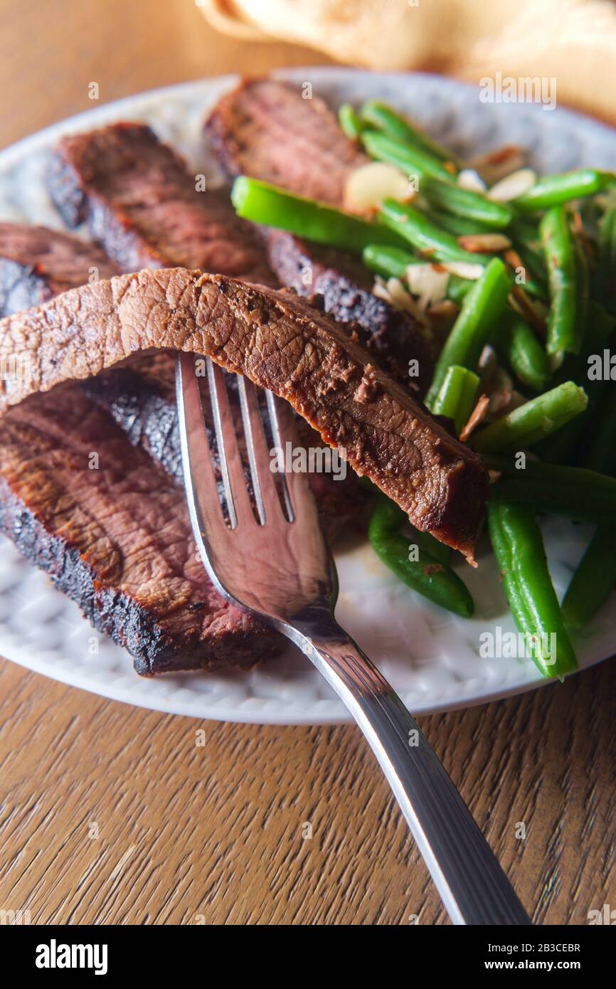Filet mignon steak dinner with green string beans in almond butter ...