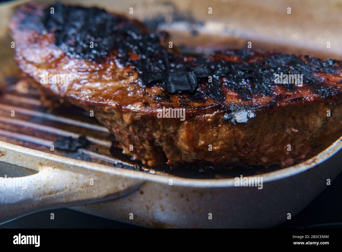 Homemade charred filet mignon steak dinner frying on stovetop Stock ...