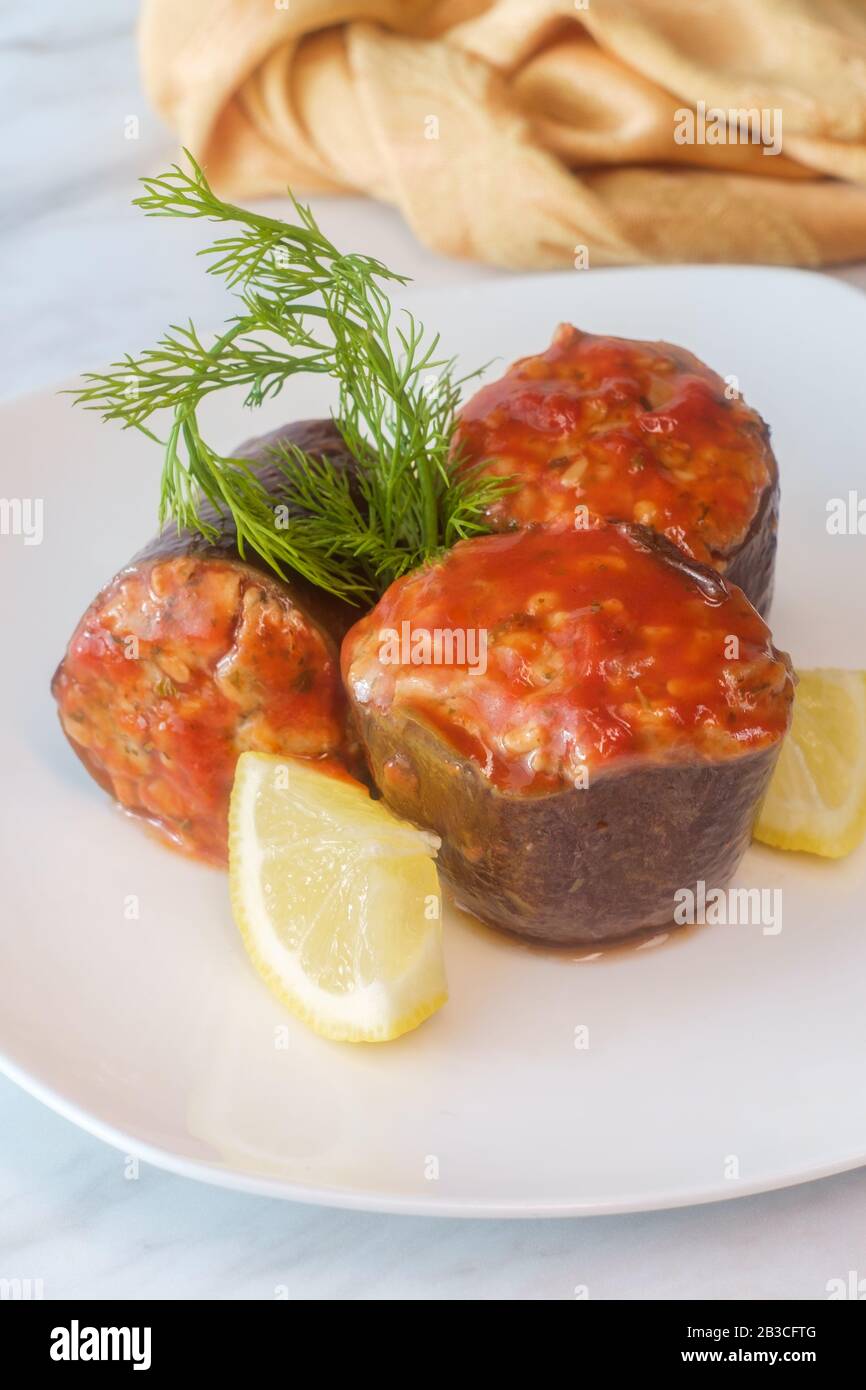 Rice and tomato sauce stuffed Israeli eggplant appetizer with lemon and ...