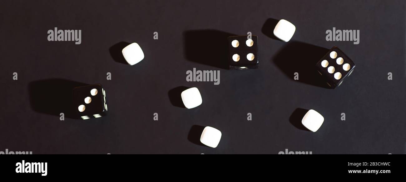 The dice are scattered on a black cloth. Concept. Banner Stock Photo ...