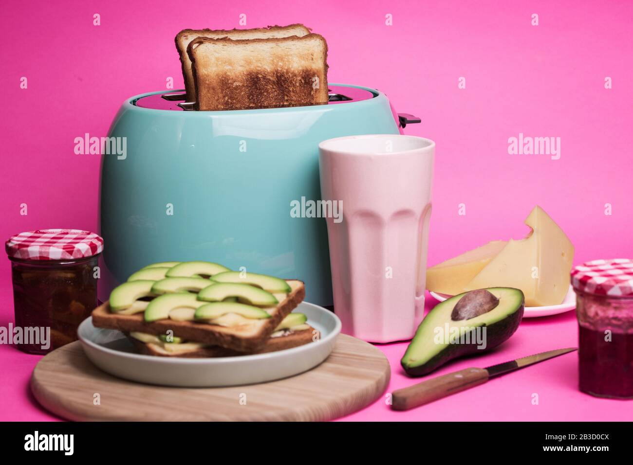 bright, fun breakfast. cyan color toaster on a pink background Stock ...