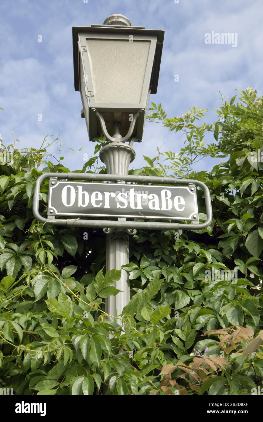 Old street sign with lantern Stock Photo - Alamy