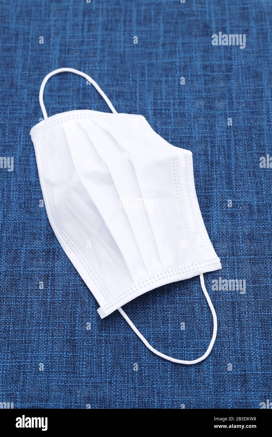 white protection face mask on the color background Stock Photo - Alamy