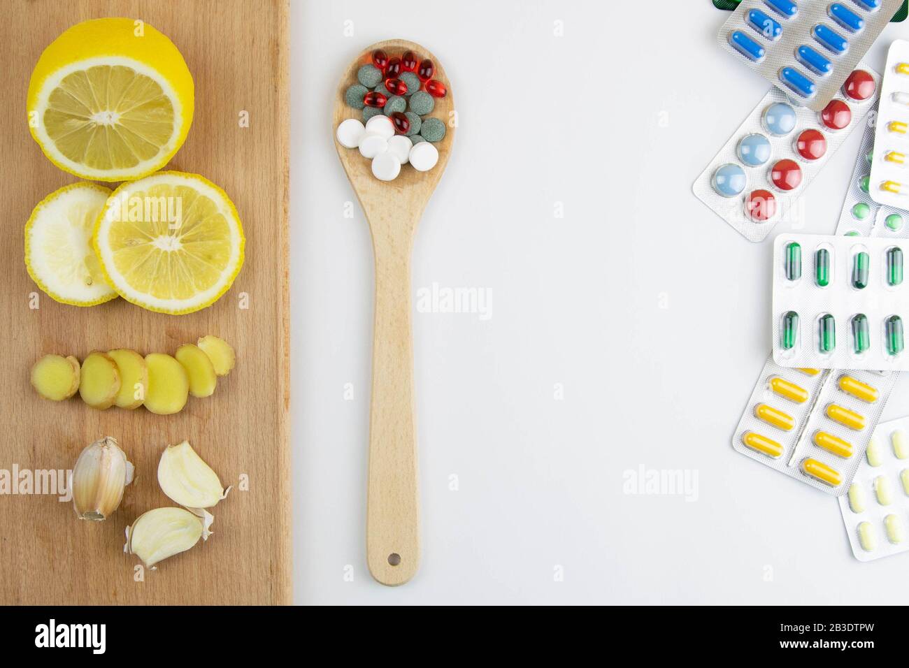 Lemon, ginger, and chapel against multi-colored tablets. The concept of ...