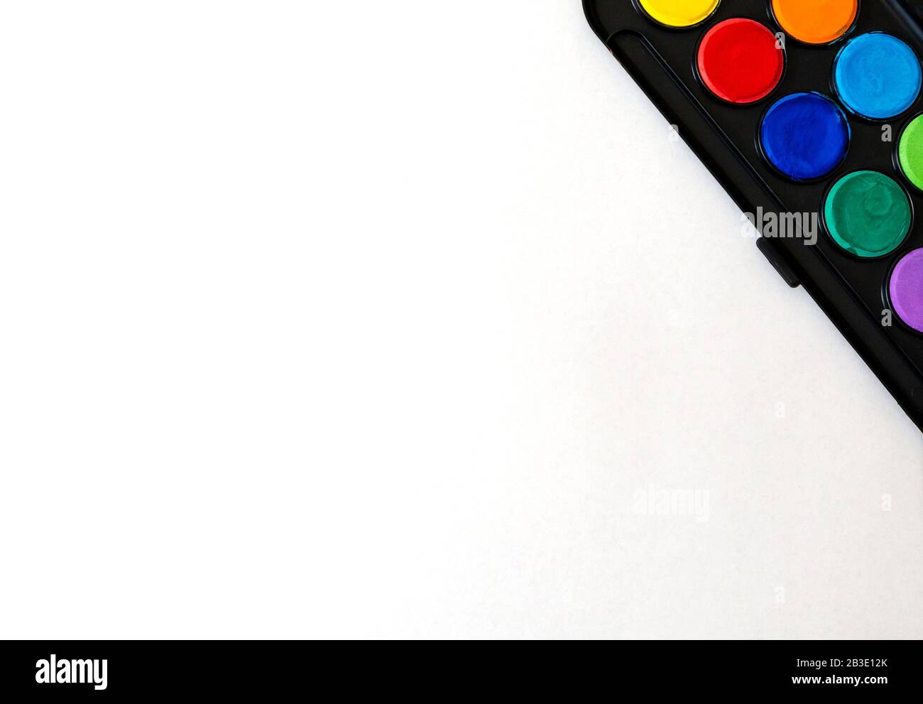 Set of watercolor paints on the white background with copy space for ...
