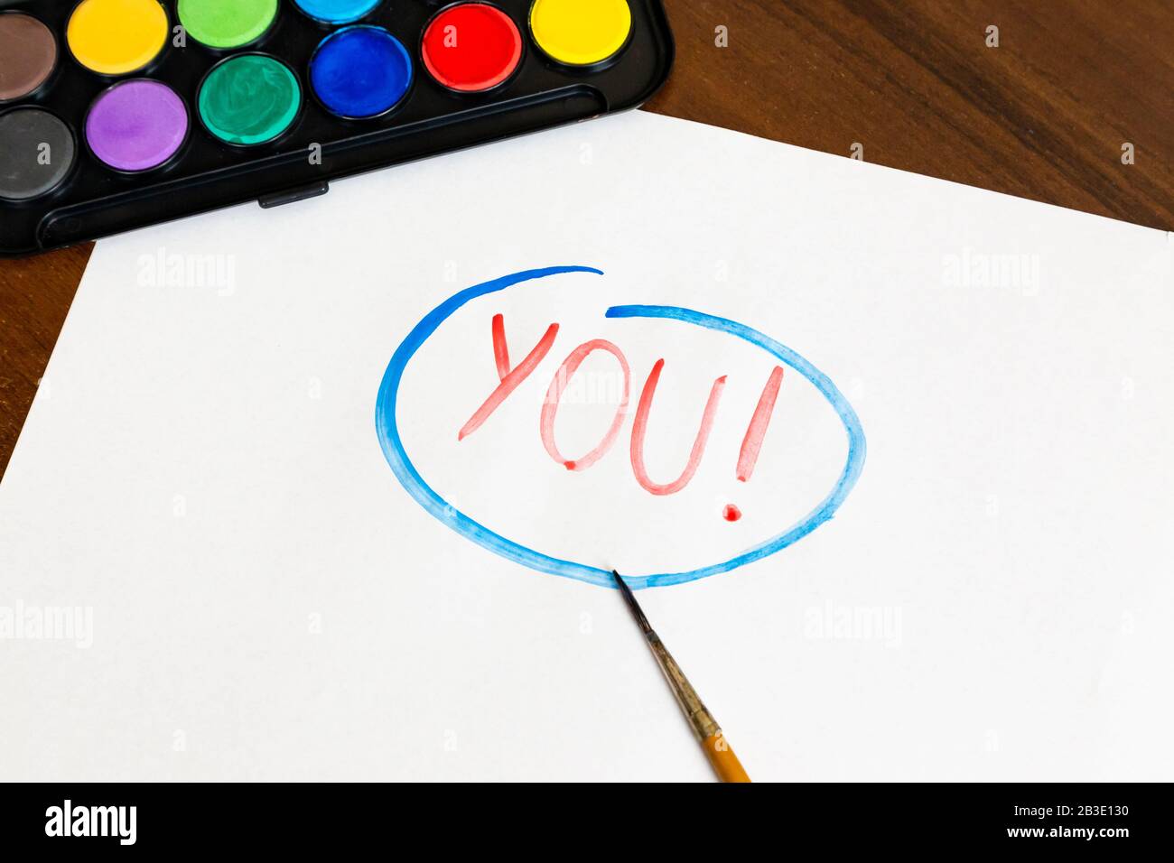 Handwritten YOU text with brush and watercolor paints on white ...