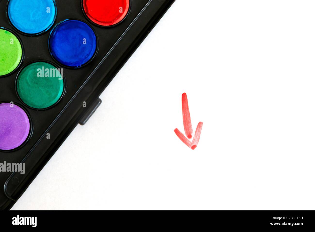 Red hand painted arrow with brush strokes isolated on the white ...