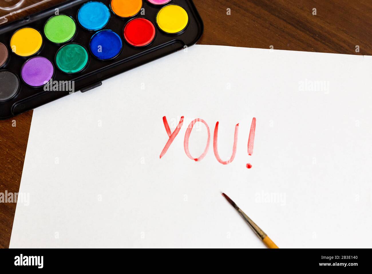 Handwritten YOU text with brush and watercolor paints on white ...