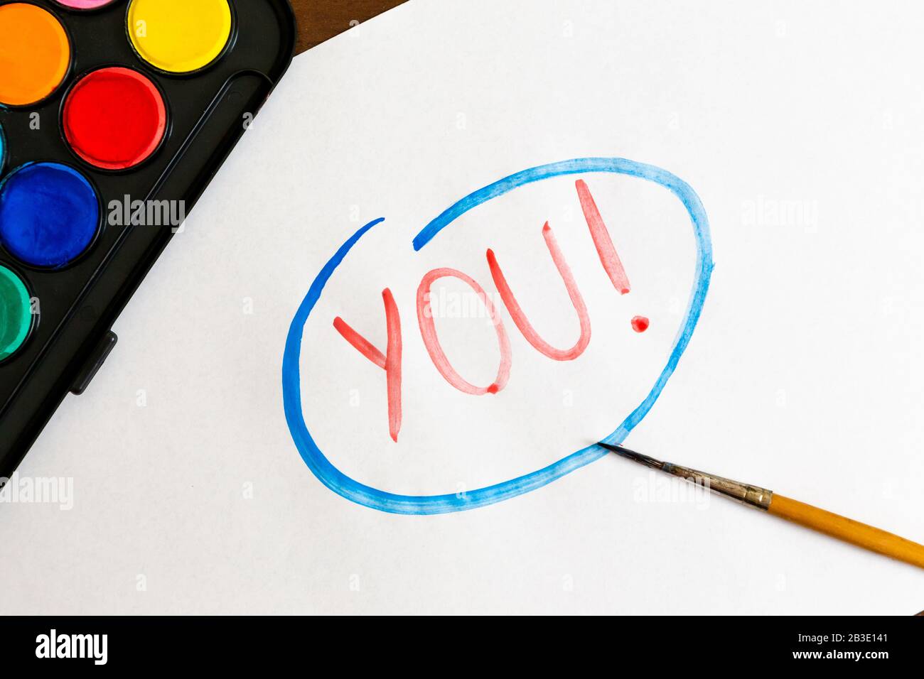 Handwritten YOU text with brush and watercolor paints on white ...
