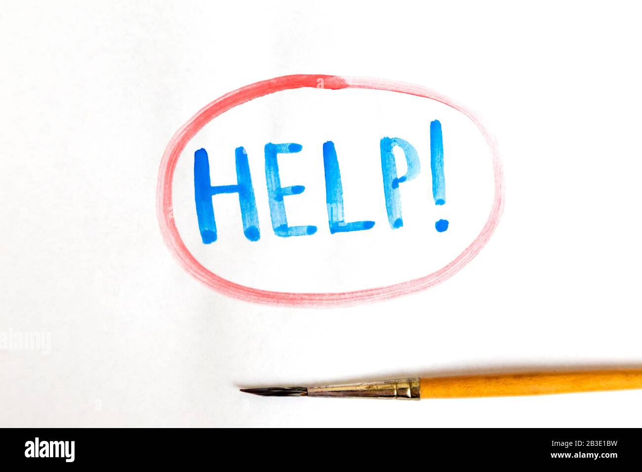 Handwritten HELP text with brush and watercolor paints on white ...